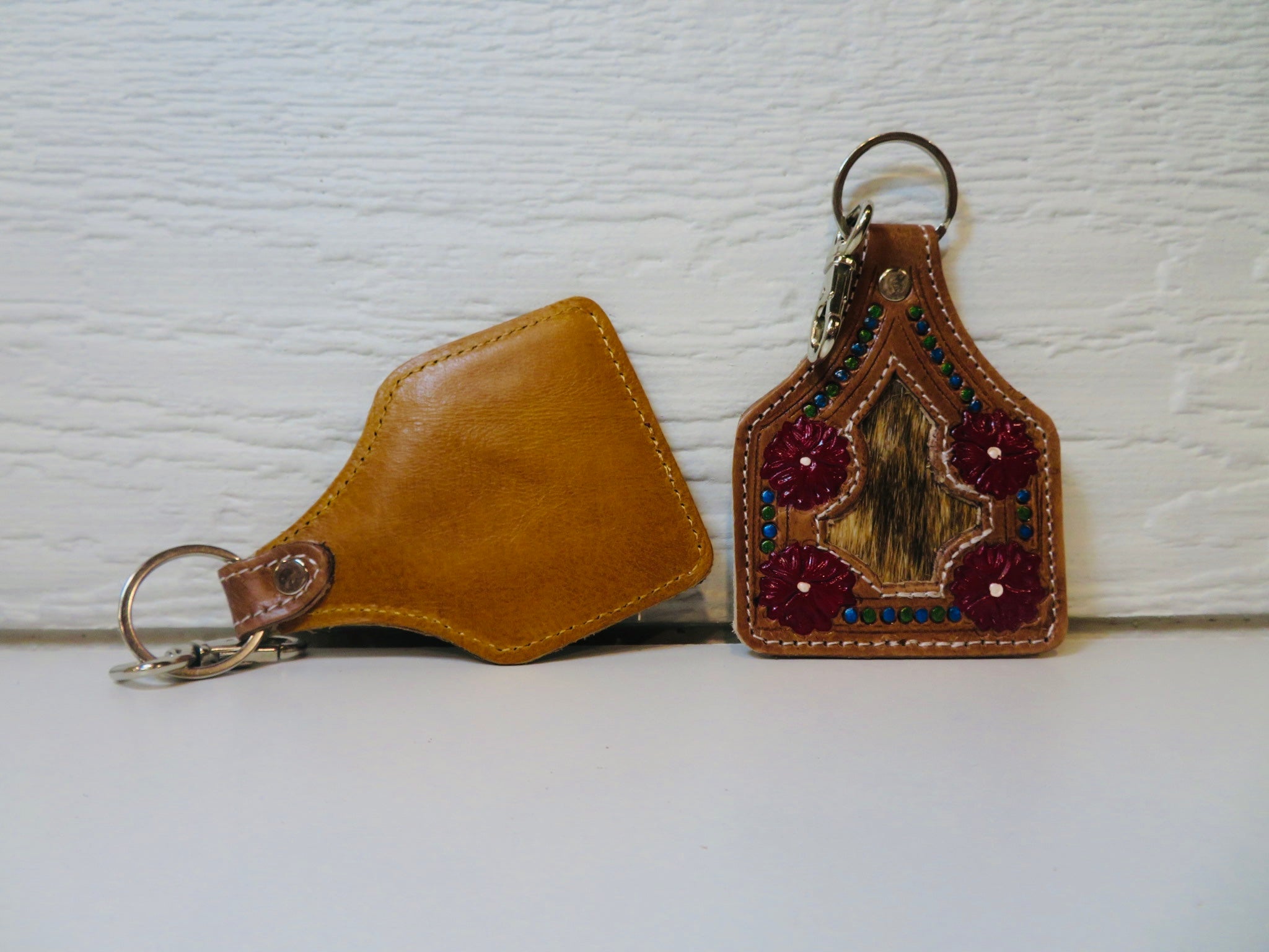 Tooled leather ear tag with cowhide – Western Impressions